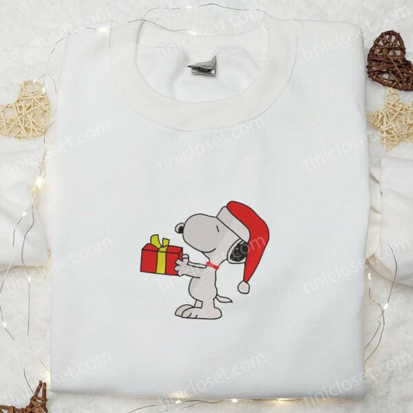 Snoopy Giving Christmas Gift Embroidered Shirt, The Peanuts Cartoon ...